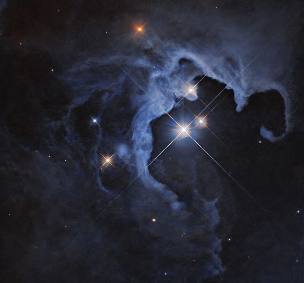Hubble takes a look a very young trinary star system
